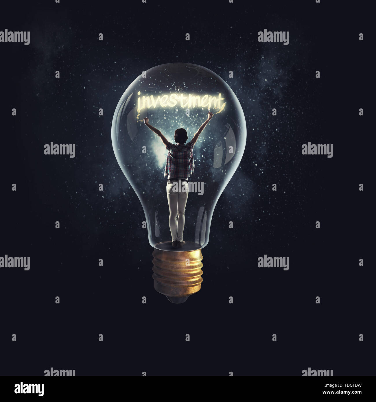 Cheerful girl inside of glass light bulb on dark background Stock Photo ...