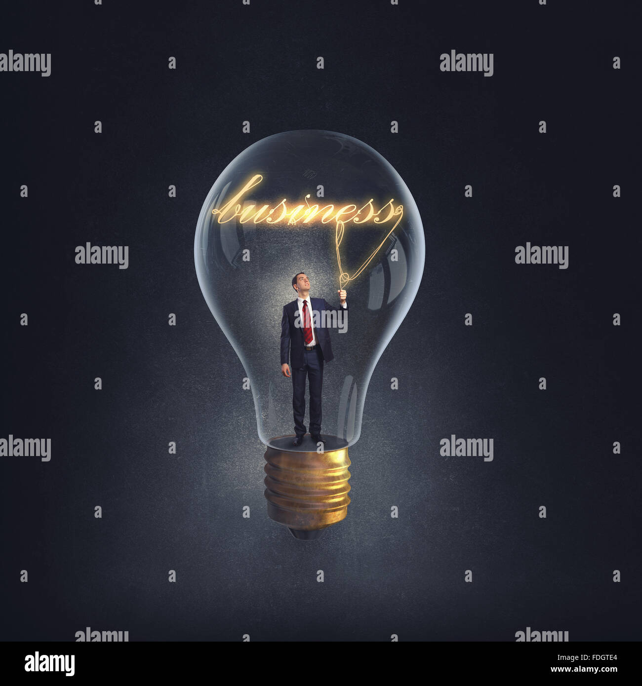 Businessman inside of glass light bulb on dark background Stock Photo ...