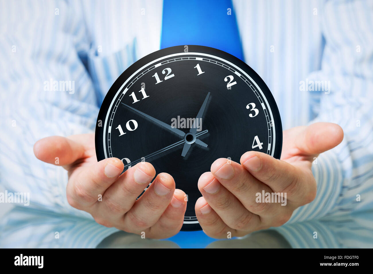 Hands of businessman holding with care time concept Stock Photo - Alamy