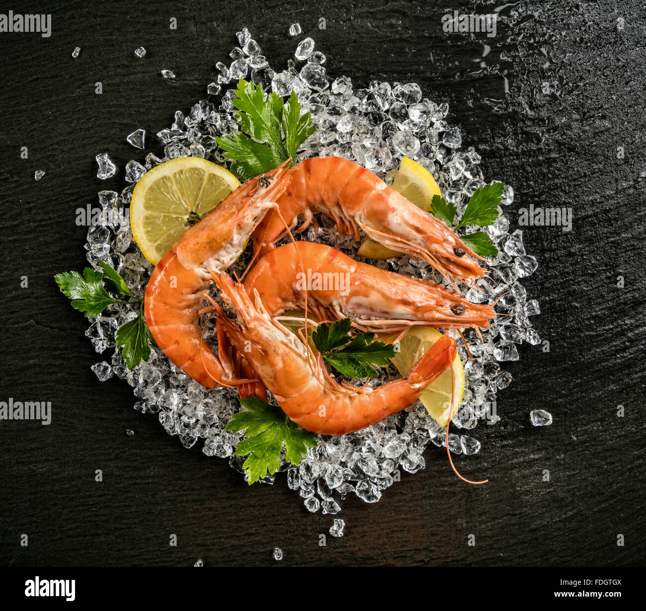 Cooked prawns served on black stone Stock Photo - Alamy