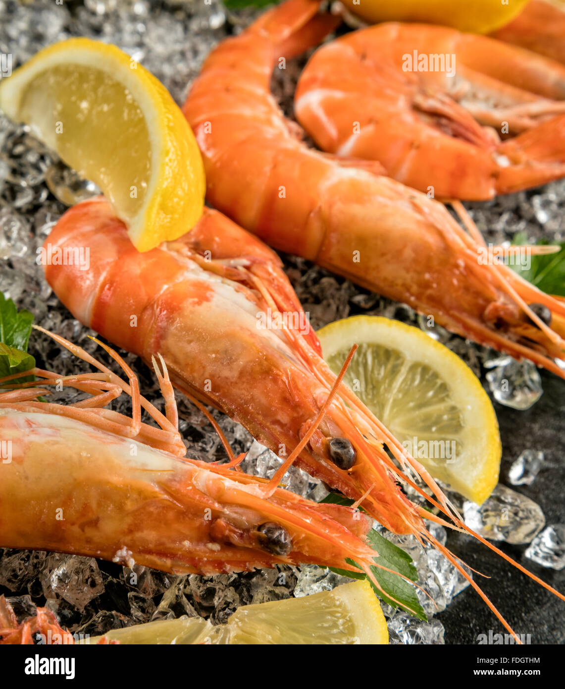 Cooked prawns served on black stone Stock Photo - Alamy