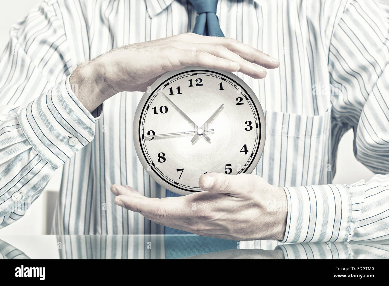Hands of businessman holding with care time concept Stock Photo - Alamy
