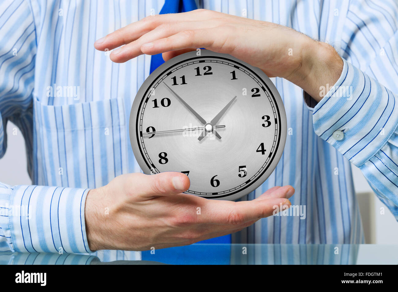 Hands of businessman holding with care time concept Stock Photo - Alamy