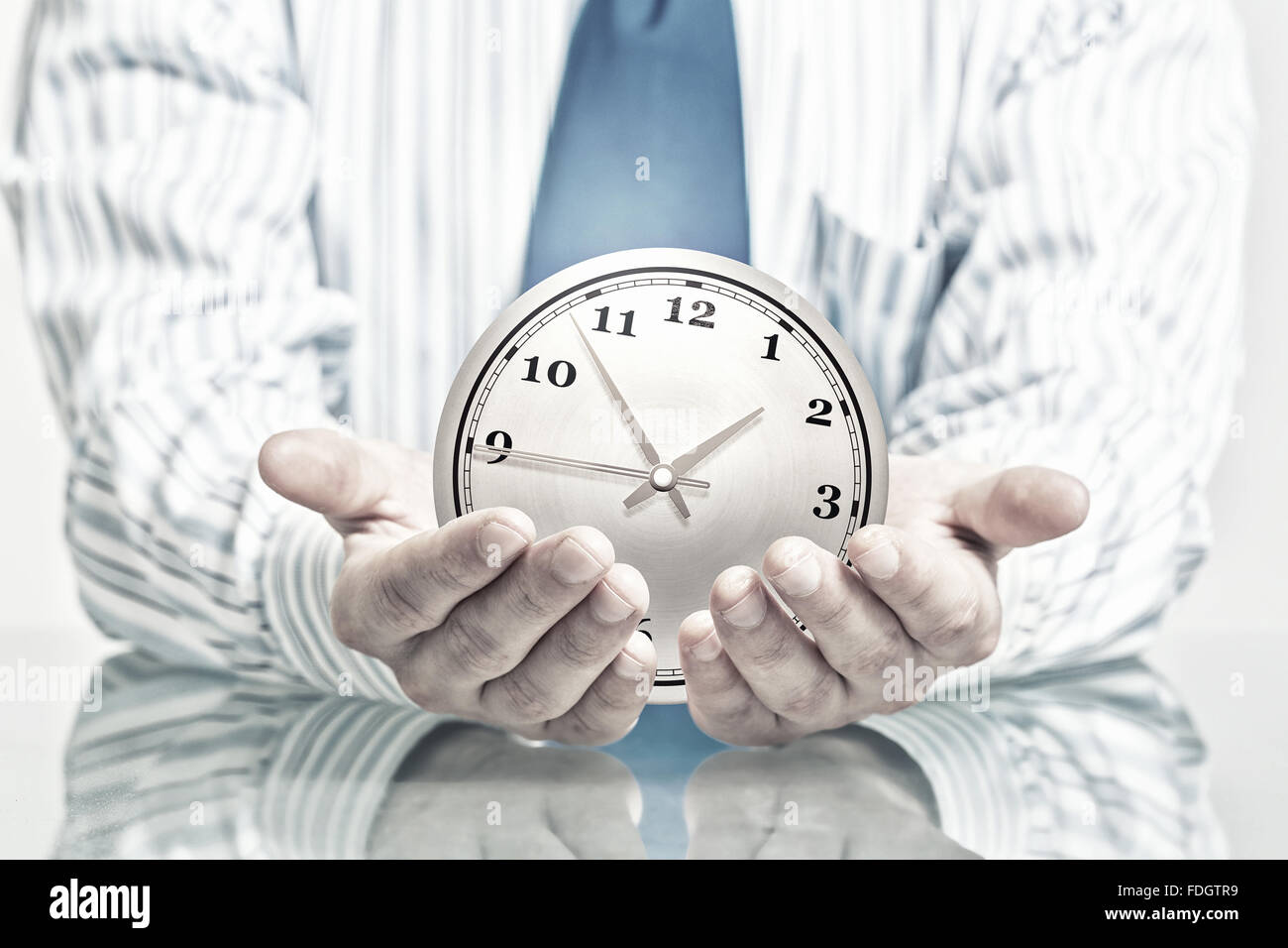 Hands of businessman holding with care time concept Stock Photo - Alamy
