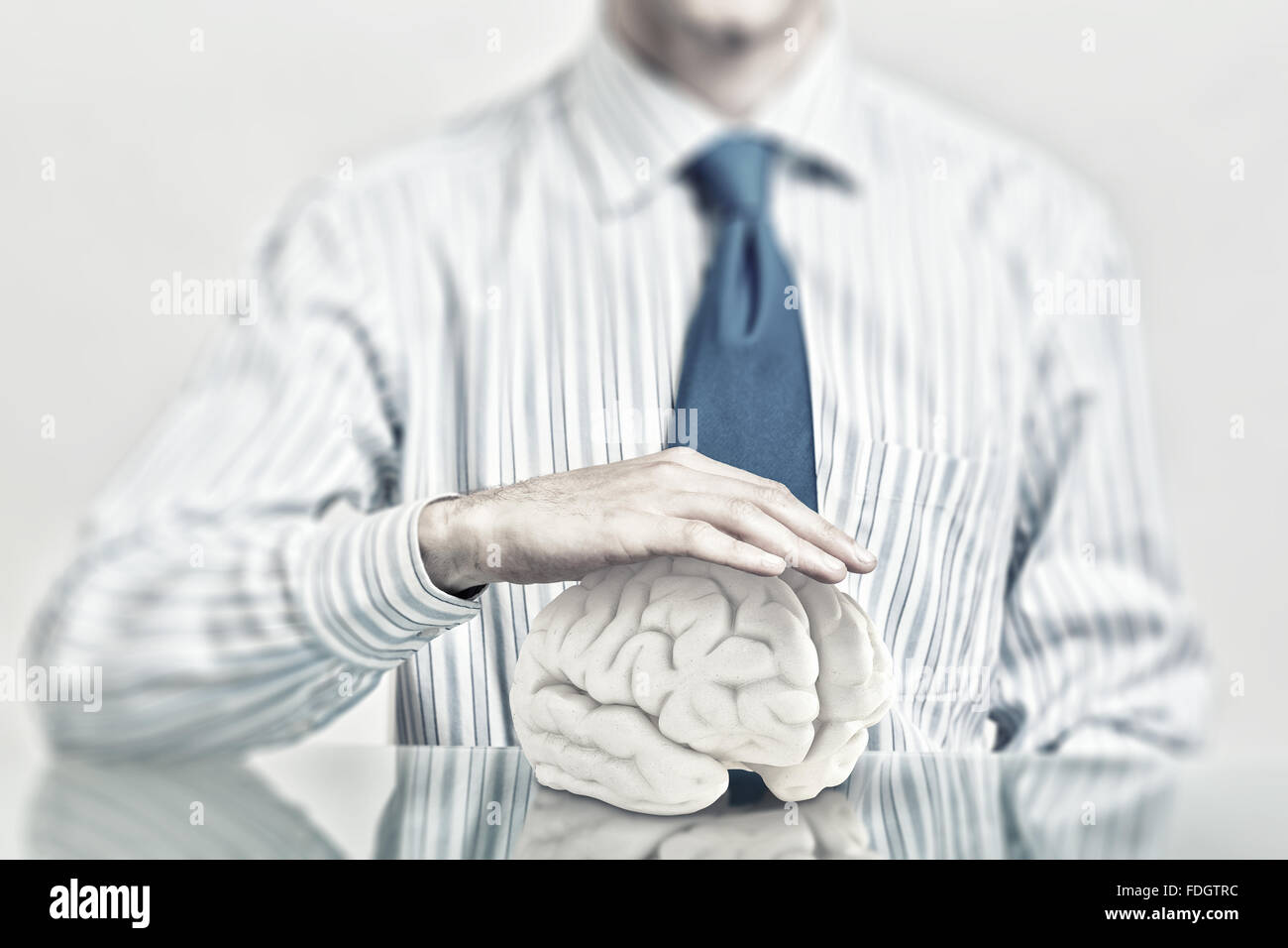 Hands of man holding with care human brain Stock Photo - Alamy