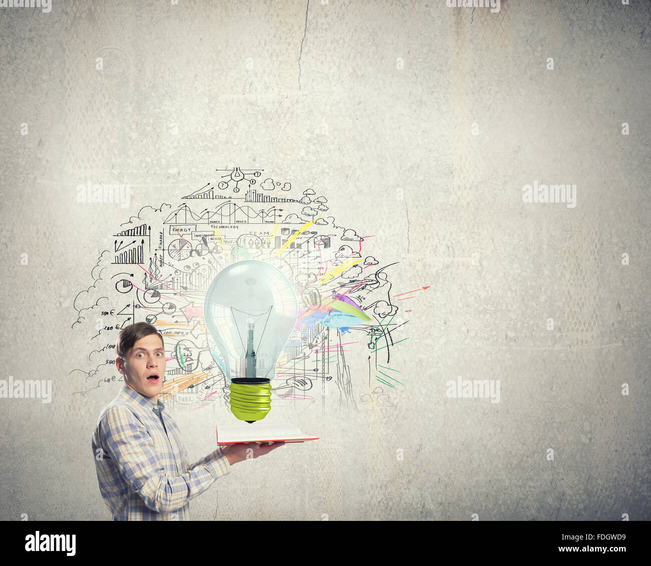 Young emotional guy with opened book in hands Stock Photo - Alamy