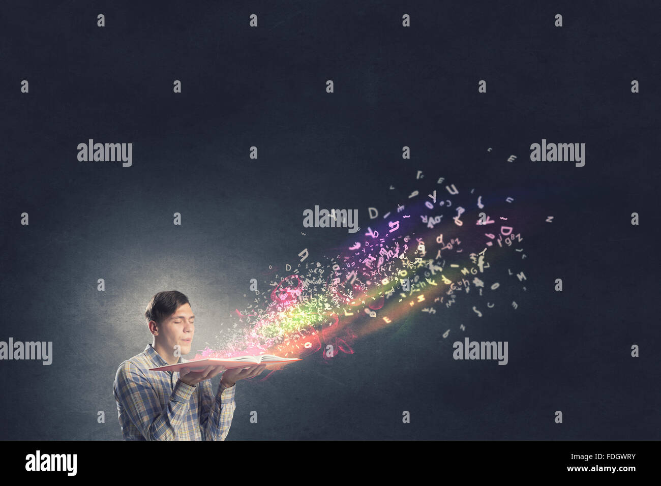 Young businessman with opened book in hands blowing on pages Stock ...