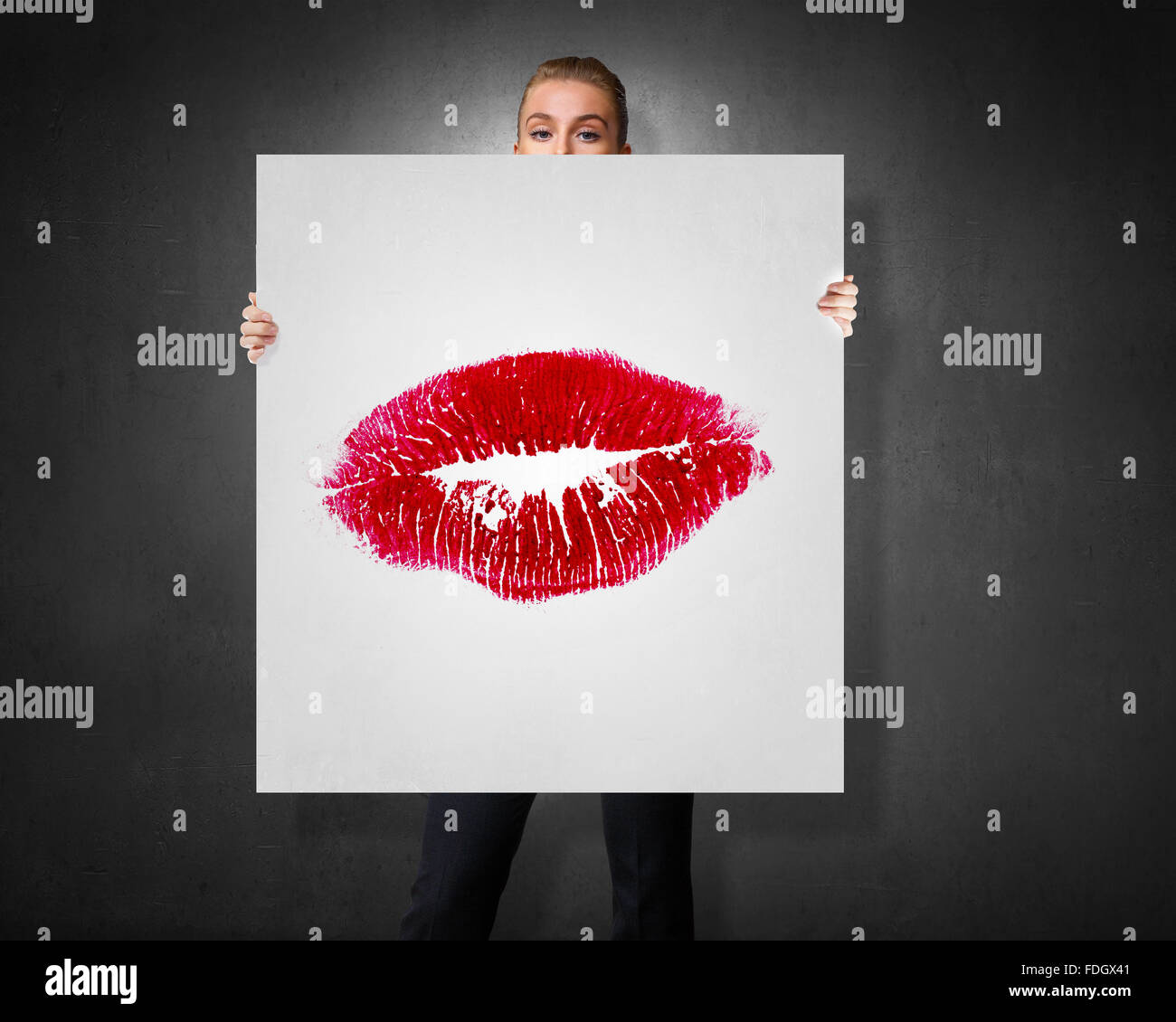 Young businesswoman showing white banner with red lips Stock Photo - Alamy