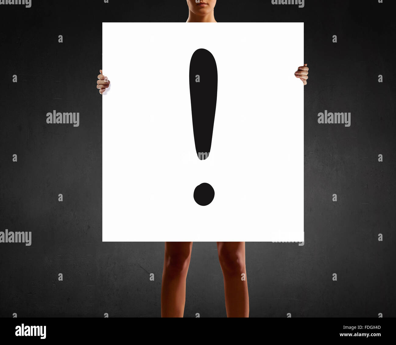Young woman showing white banner with exclamation mark Stock Photo - Alamy