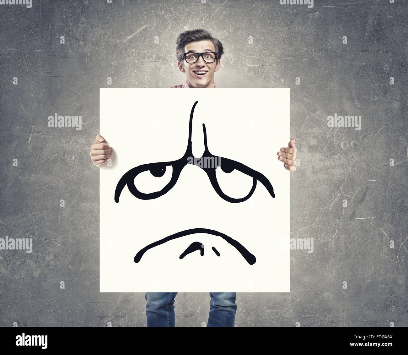 Businessman hold white board with sad face emoticon Stock Photo - Alamy