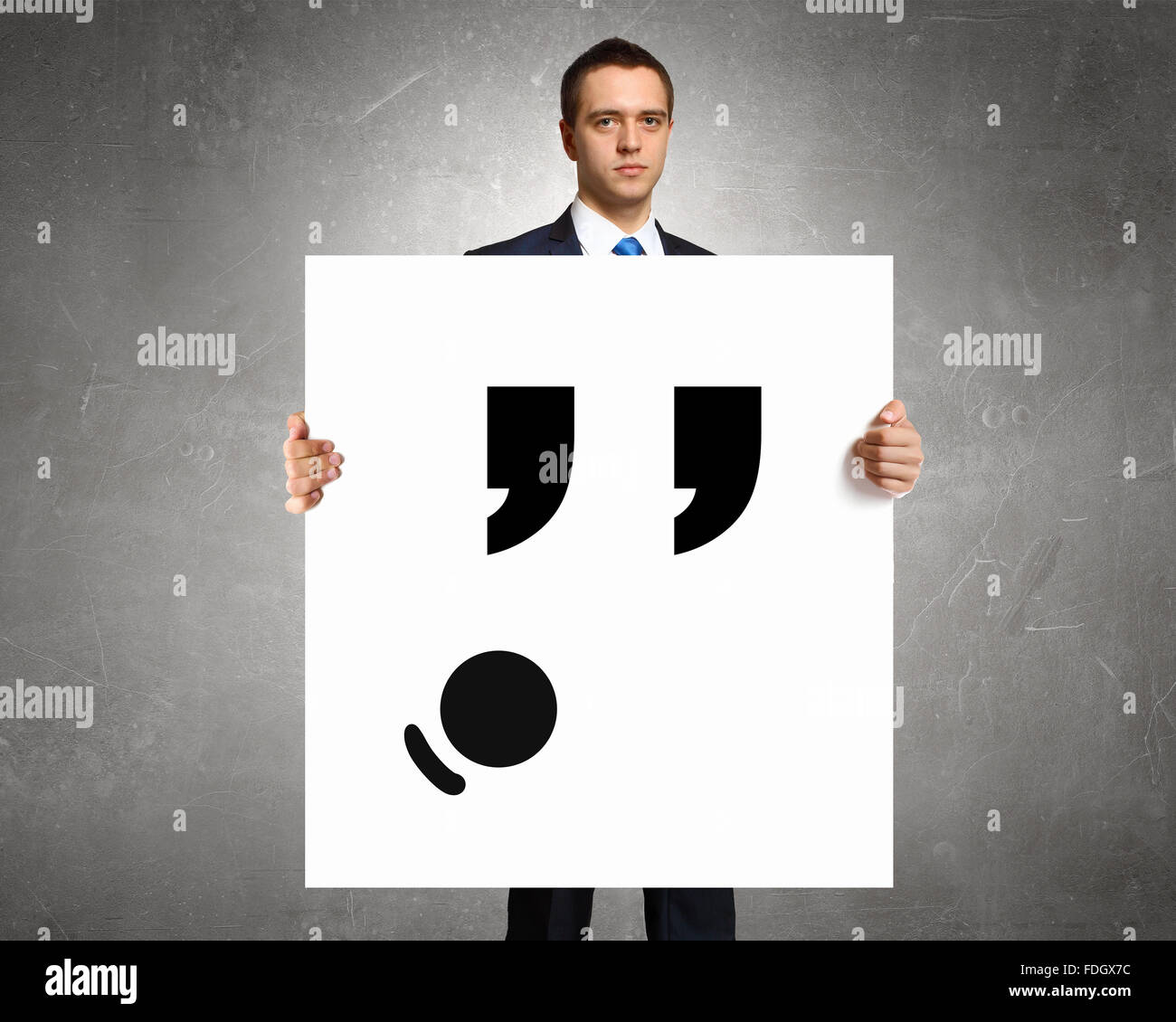 Businessman hold white board with sad face emoticon Stock Photo - Alamy