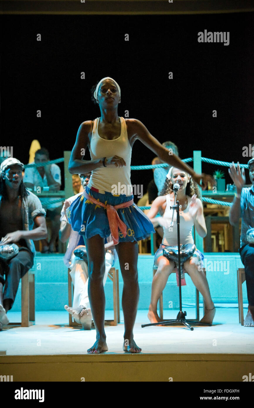Vertical portrait of Cape Verdeans dancing and playing traditional ...