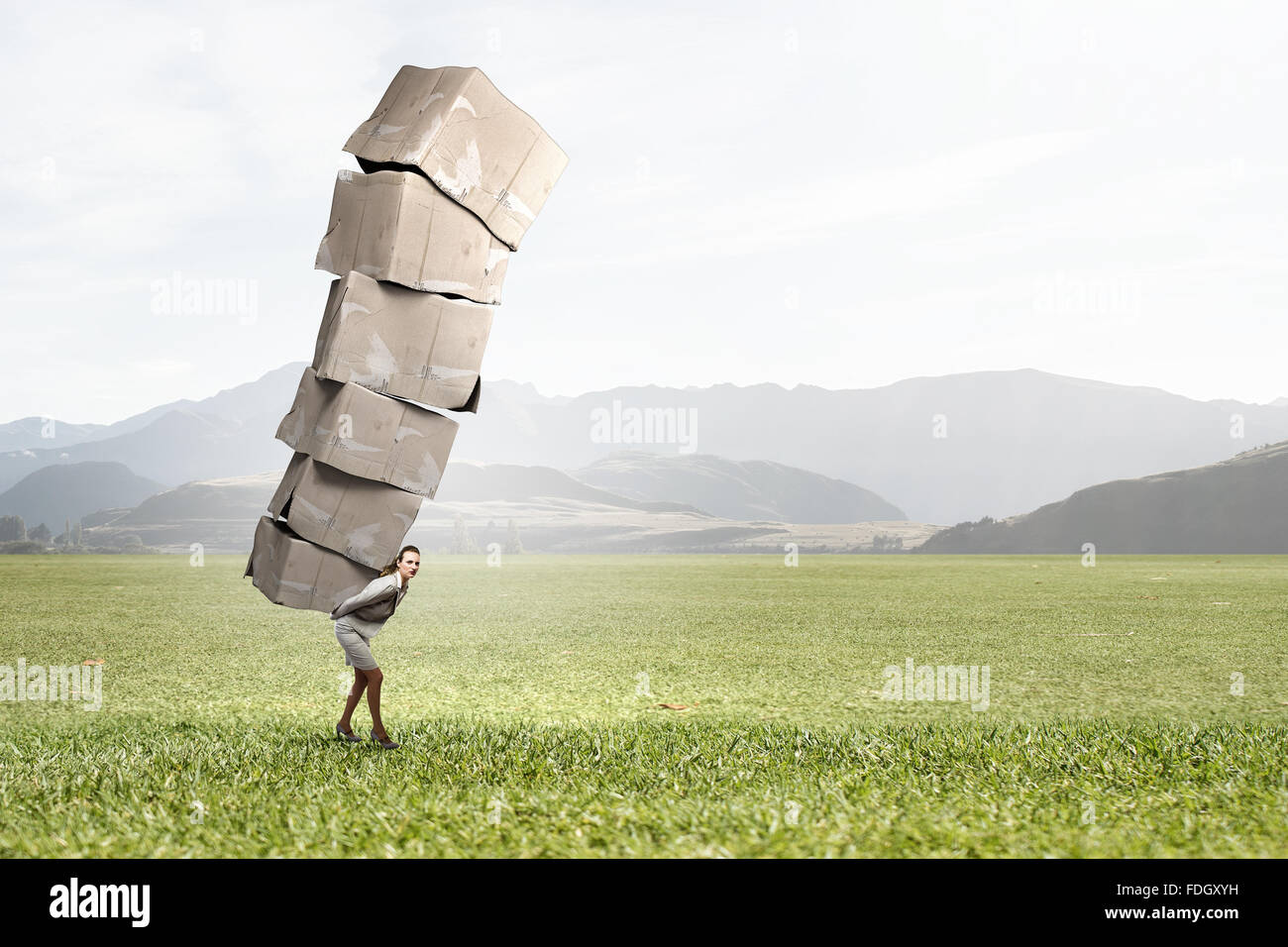 Businesswoman carrying big stack of carton boxes on her back Stock ...