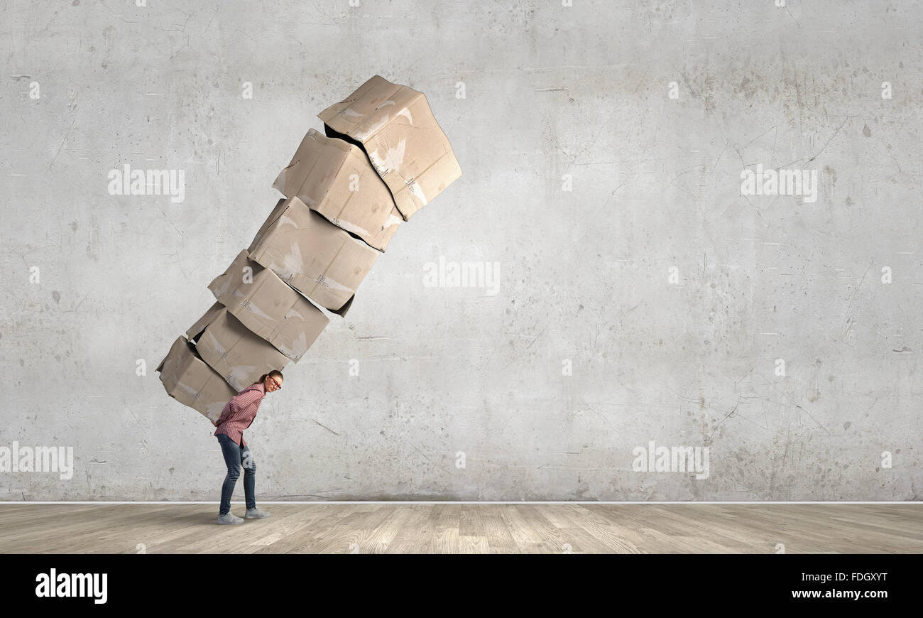 Young girl in casual carrying stack of carton boxes Stock Photo - Alamy