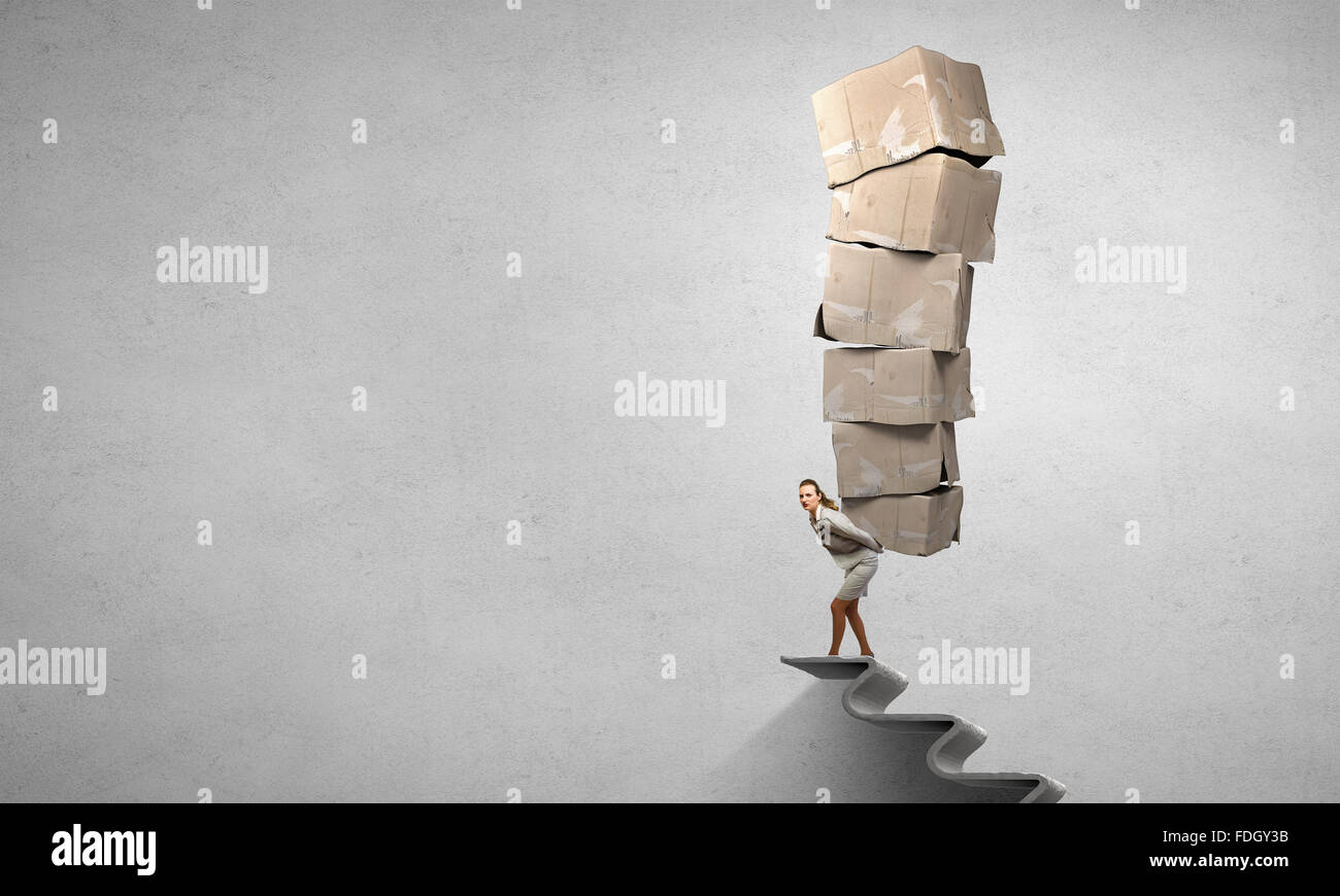 Businesswoman carrying big stack of carton boxes on her back Stock ...