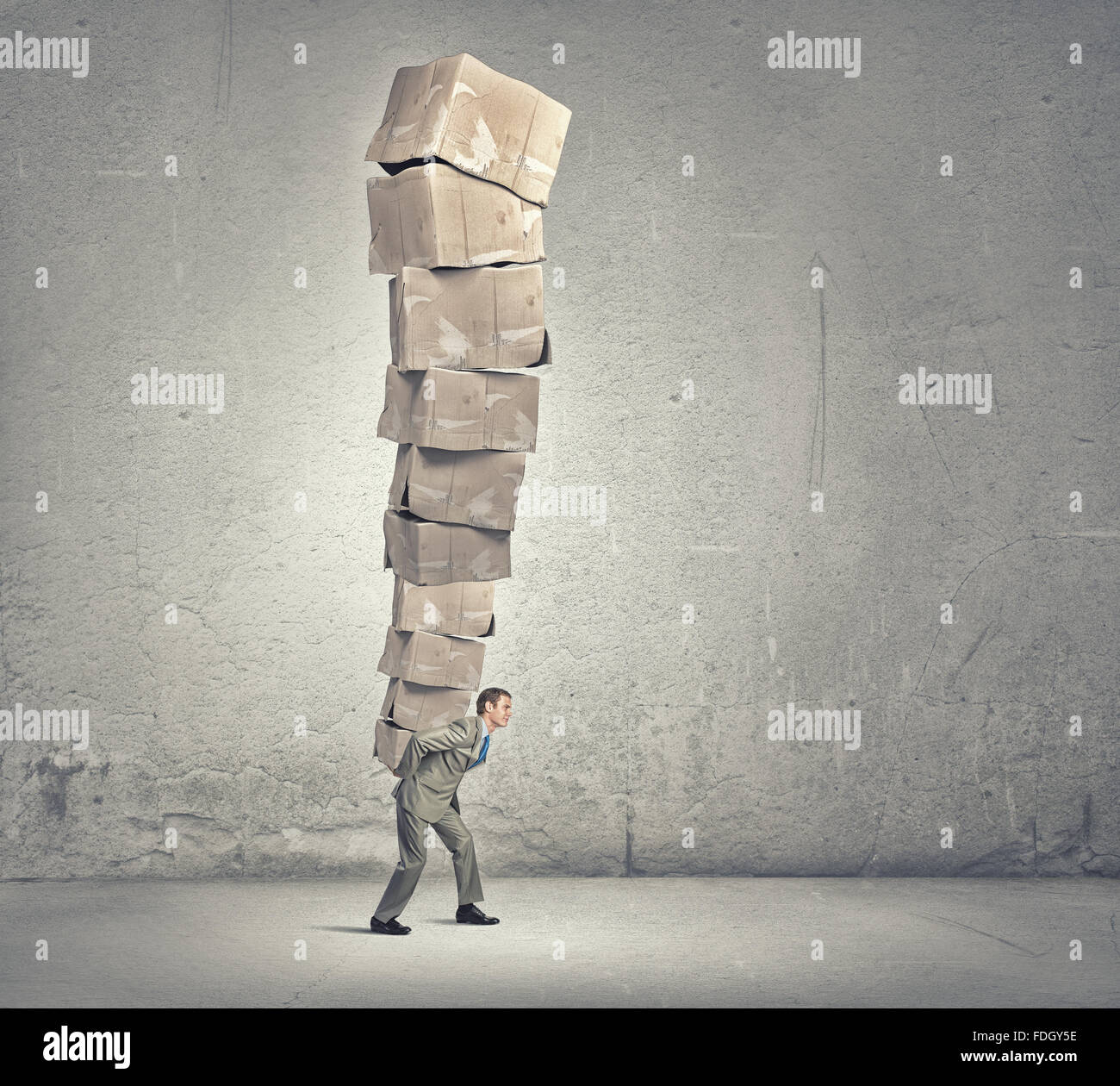 Young businessman in suit carrying big stack of carton boxes Stock ...