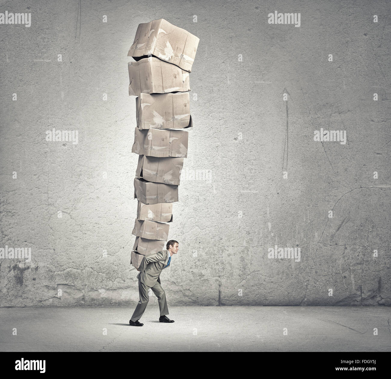 Young businessman in suit carrying big stack of carton boxes Stock ...