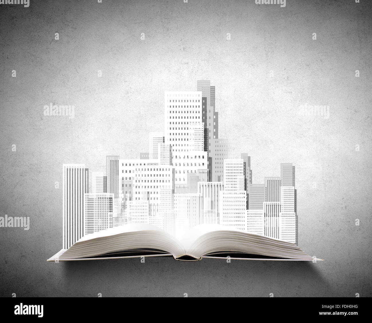 Opened book with modern city model on pages Stock Photo - Alamy