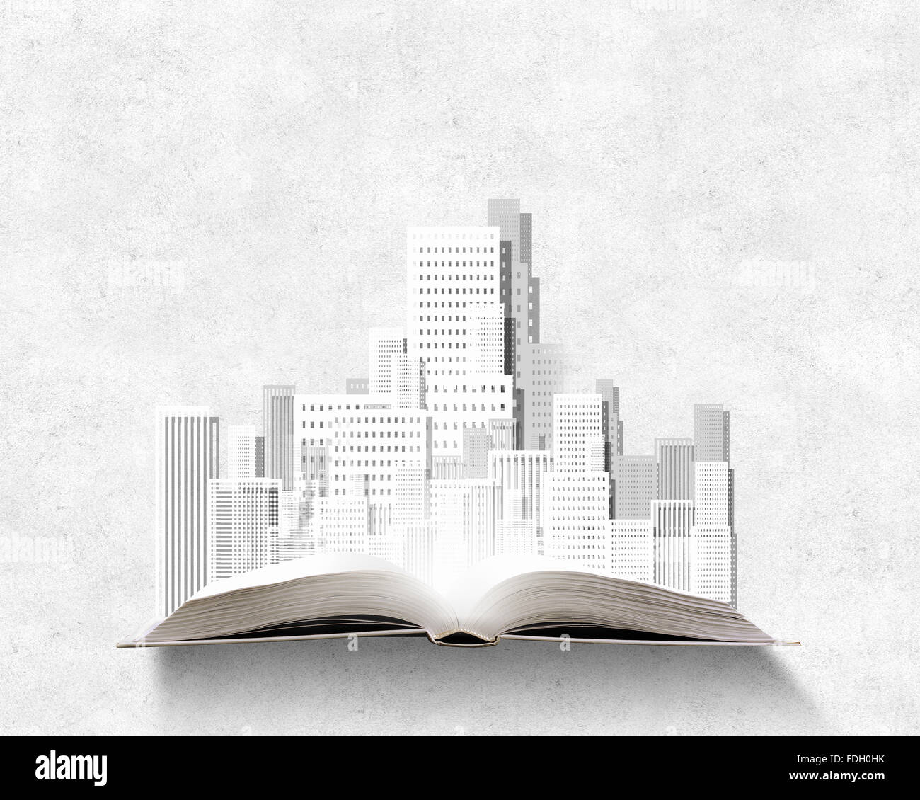 Opened book with modern city model on pages Stock Photo - Alamy