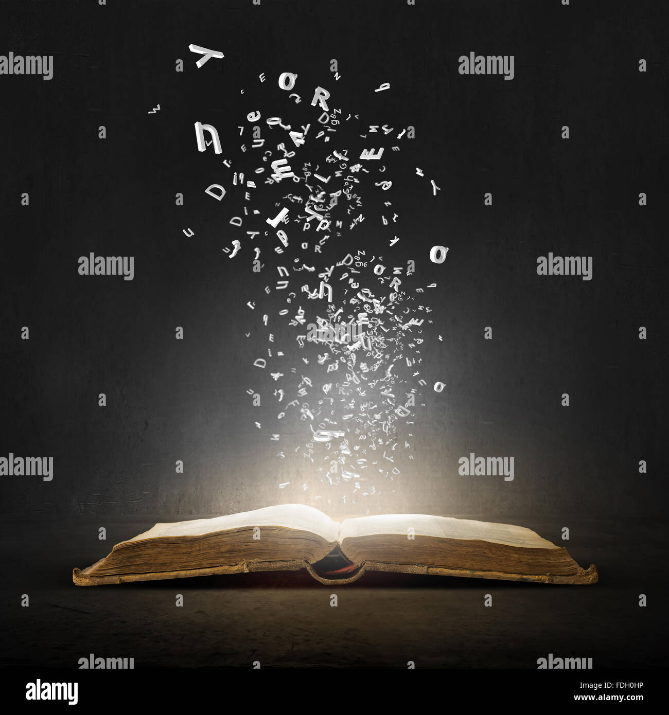 Old opened book with characters flying out of pages Stock Photo - Alamy