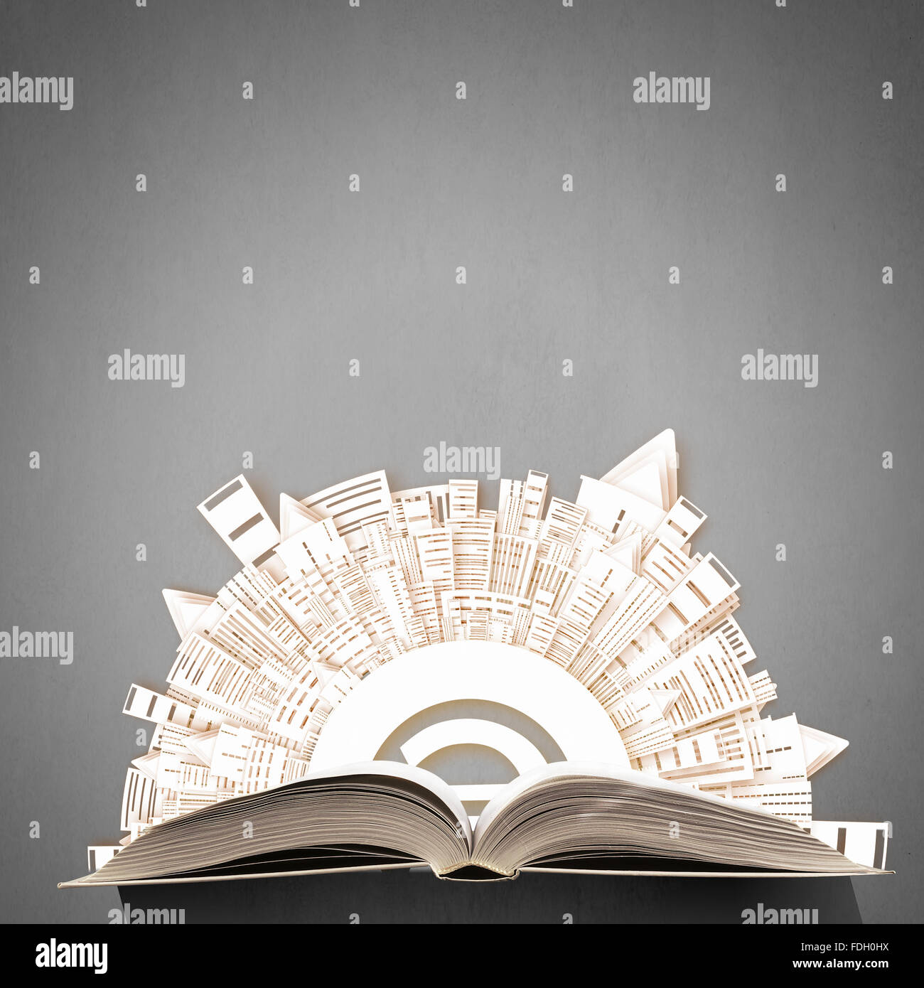Opened book with modern city model on pages Stock Photo - Alamy