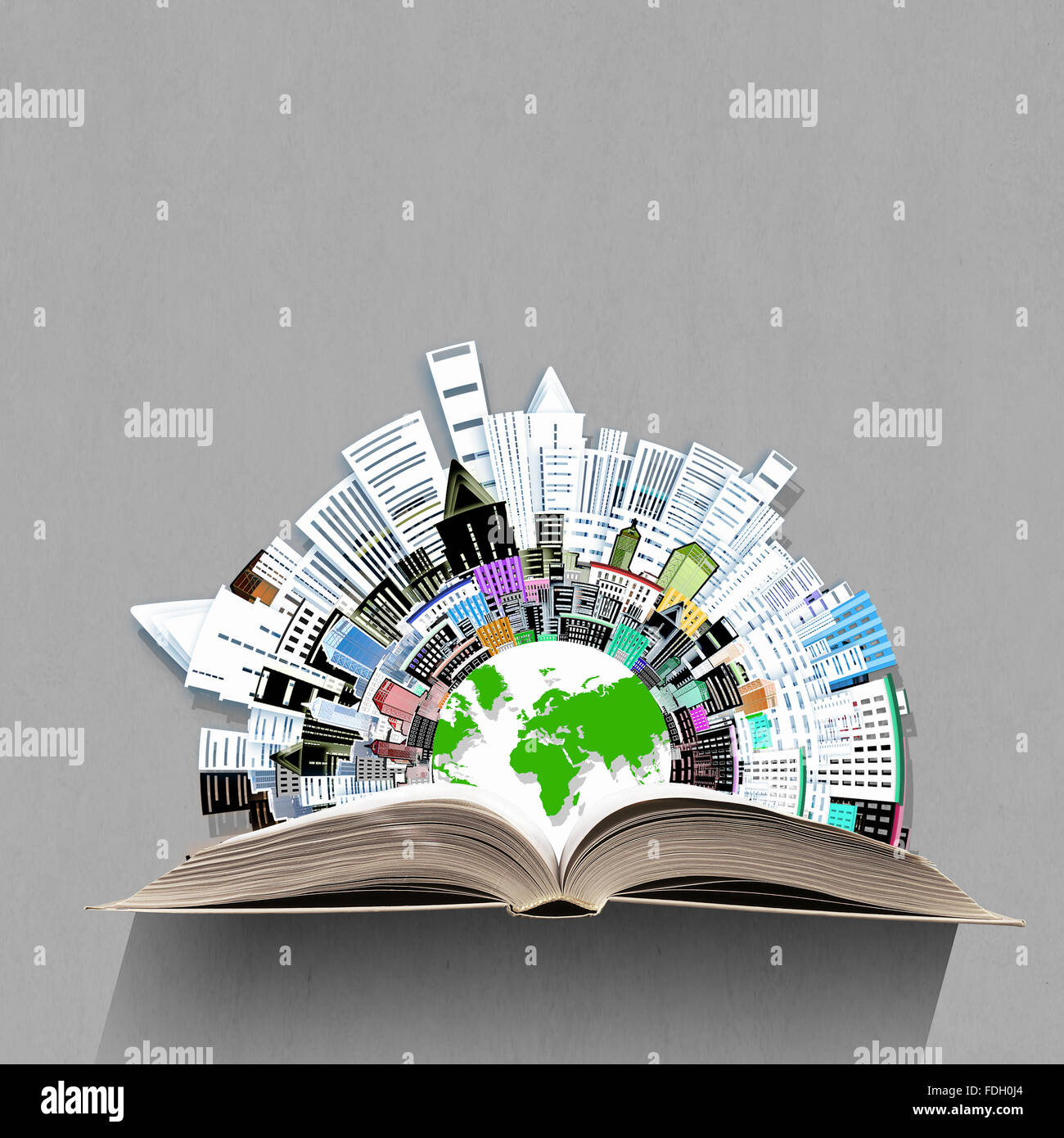 Opened book with modern city model on pages Stock Photo - Alamy