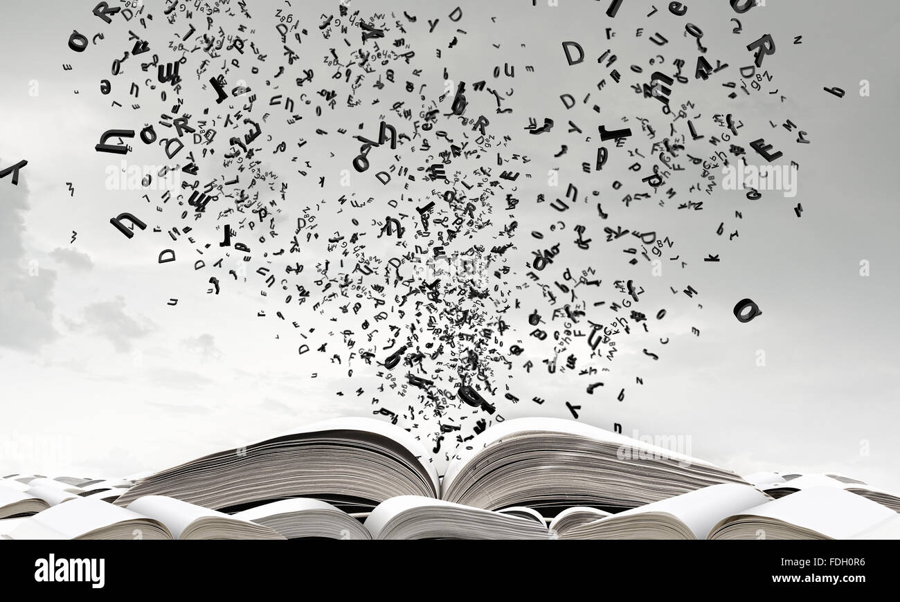 Opened book with characters flying out of pages Stock Photo - Alamy