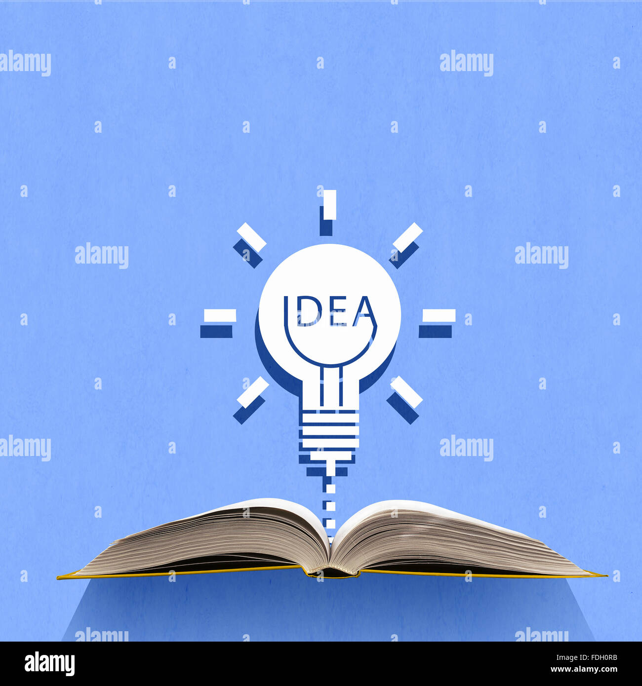 Opened book and idea light bulb on pages Stock Photo - Alamy