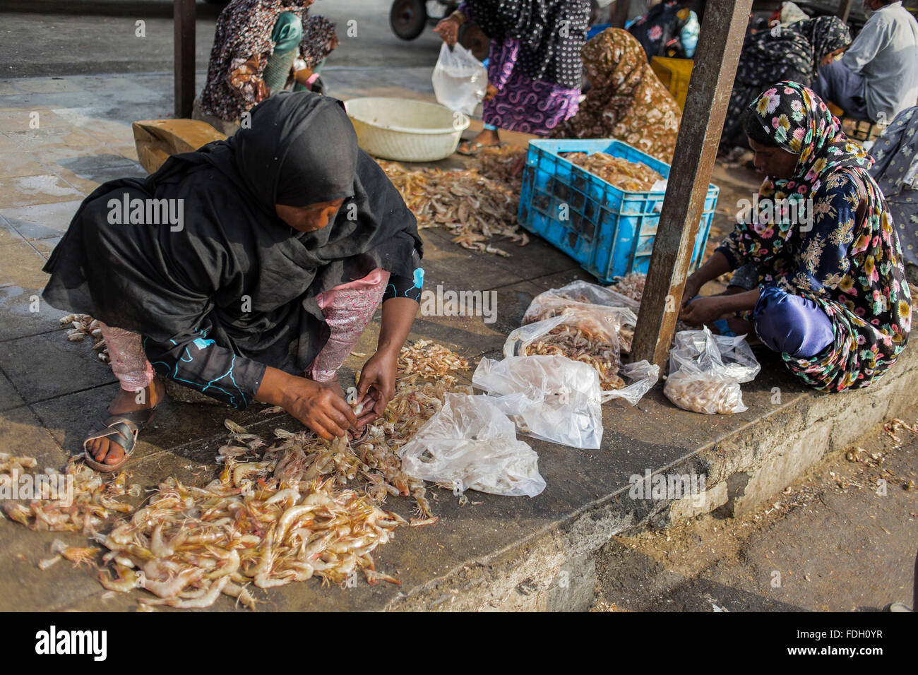 Woman cleaning fish hi-res stock photography and images - Alamy