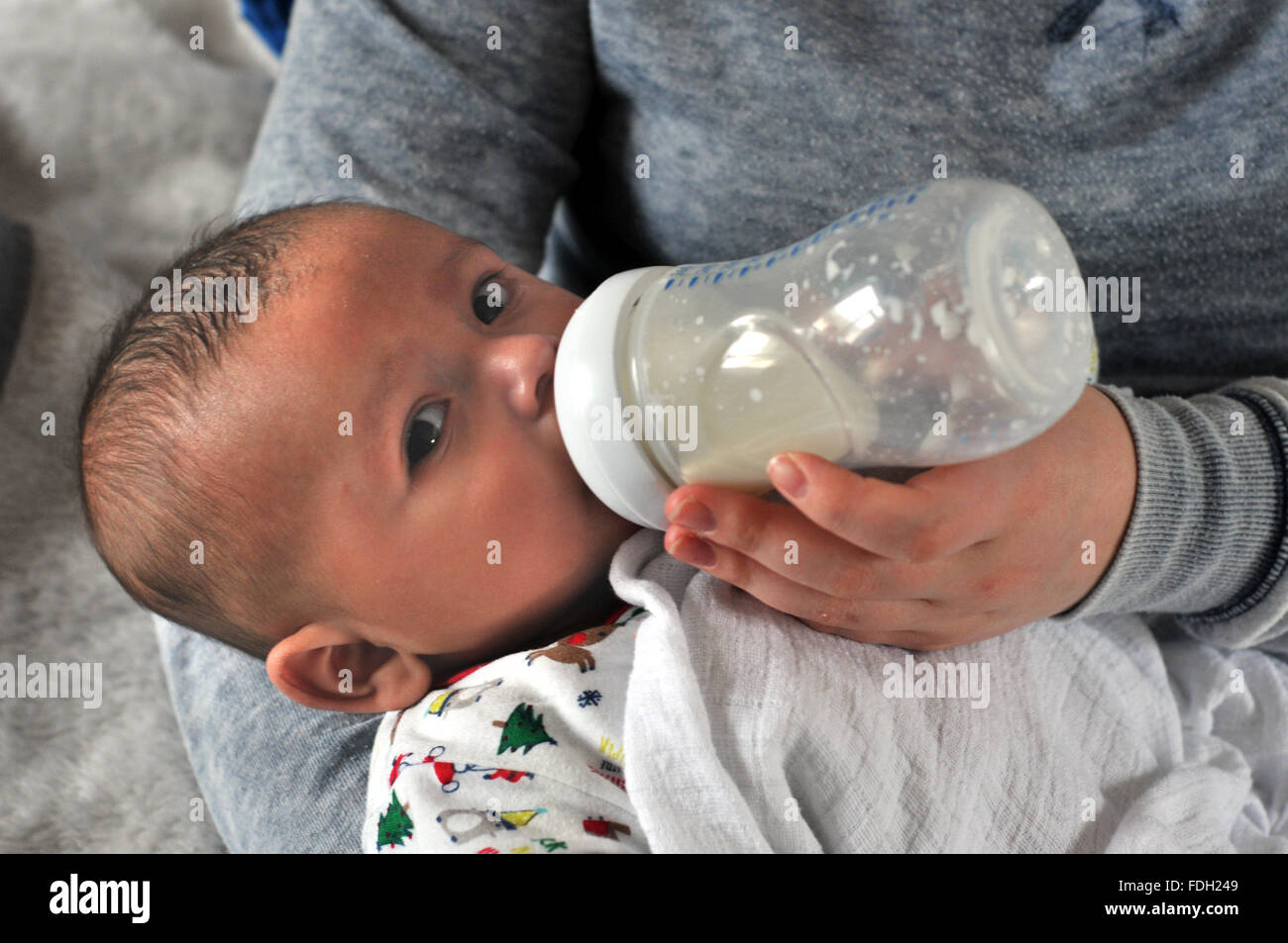 A baby feeding Stock Photo - Alamy