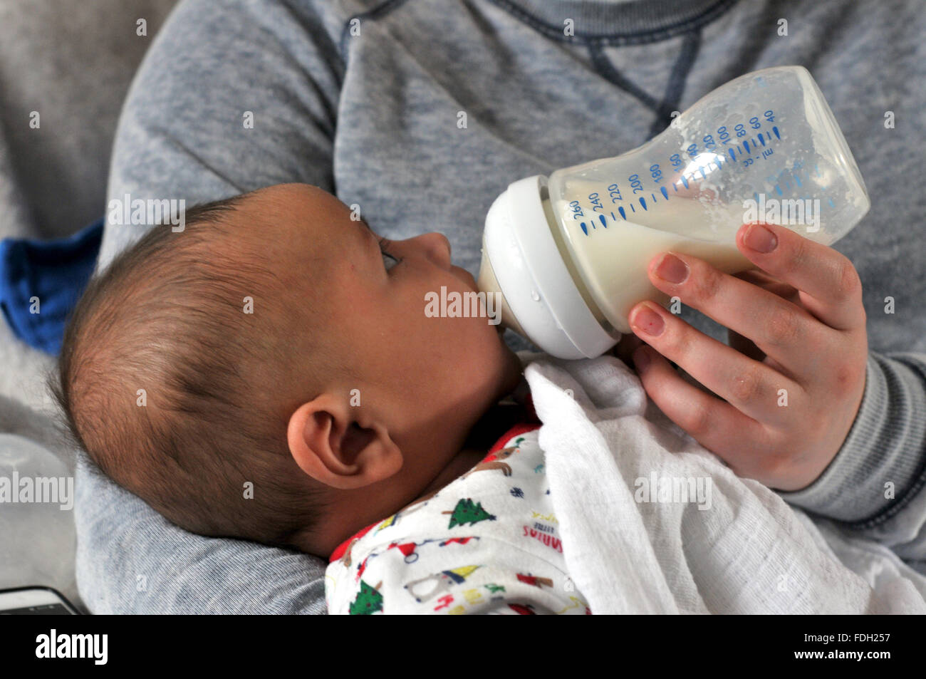 A baby feeding Stock Photo - Alamy