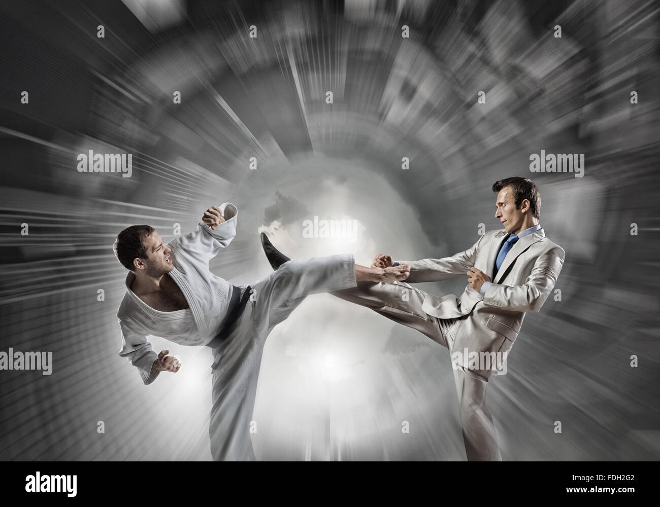 Young determined karate man fighting with businessman in suit Stock ...
