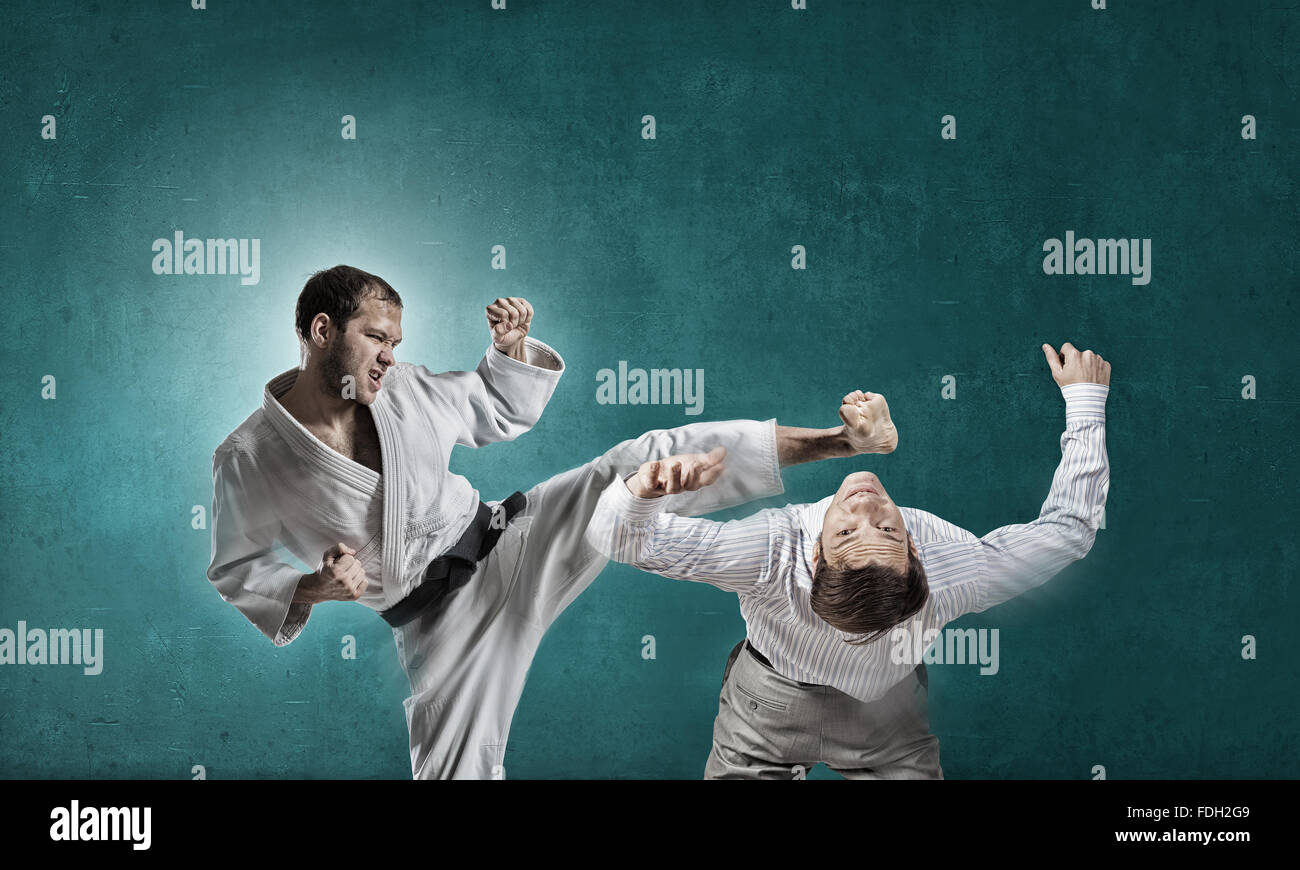 Businessman in martial arts fighting hi-res stock photography and ...