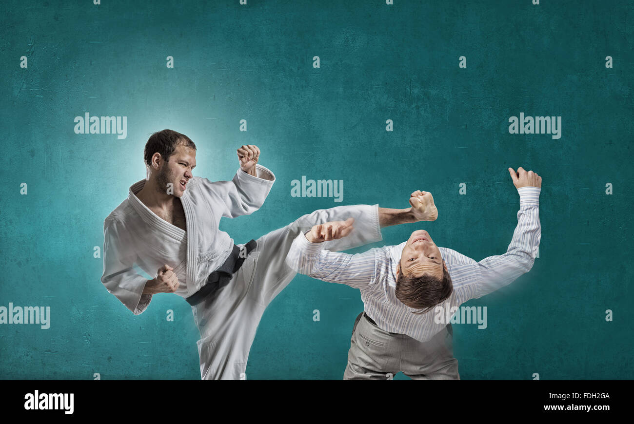 Businessman in martial arts fighting hi-res stock photography and ...