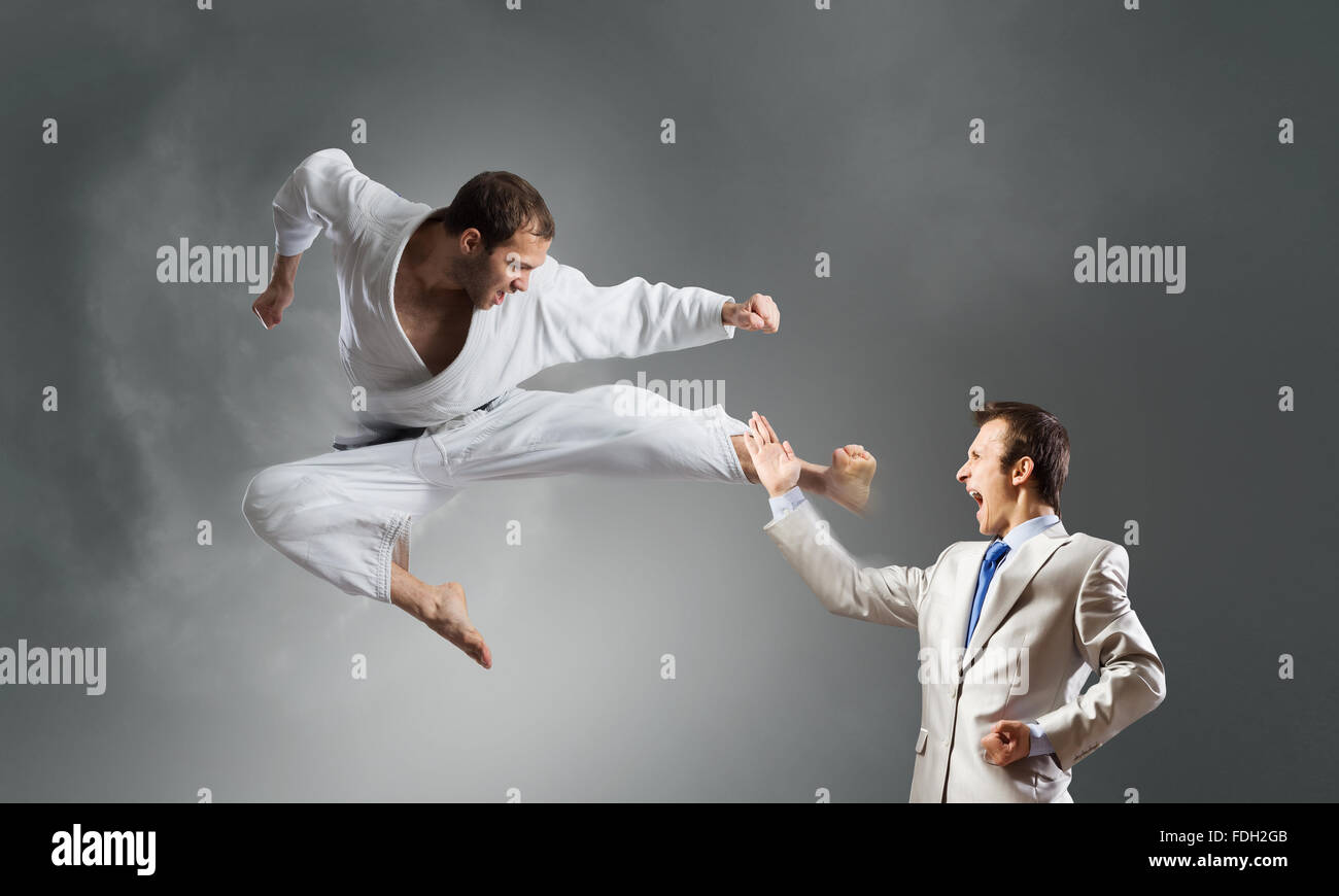 Businessman in martial arts fighting hi-res stock photography and ...