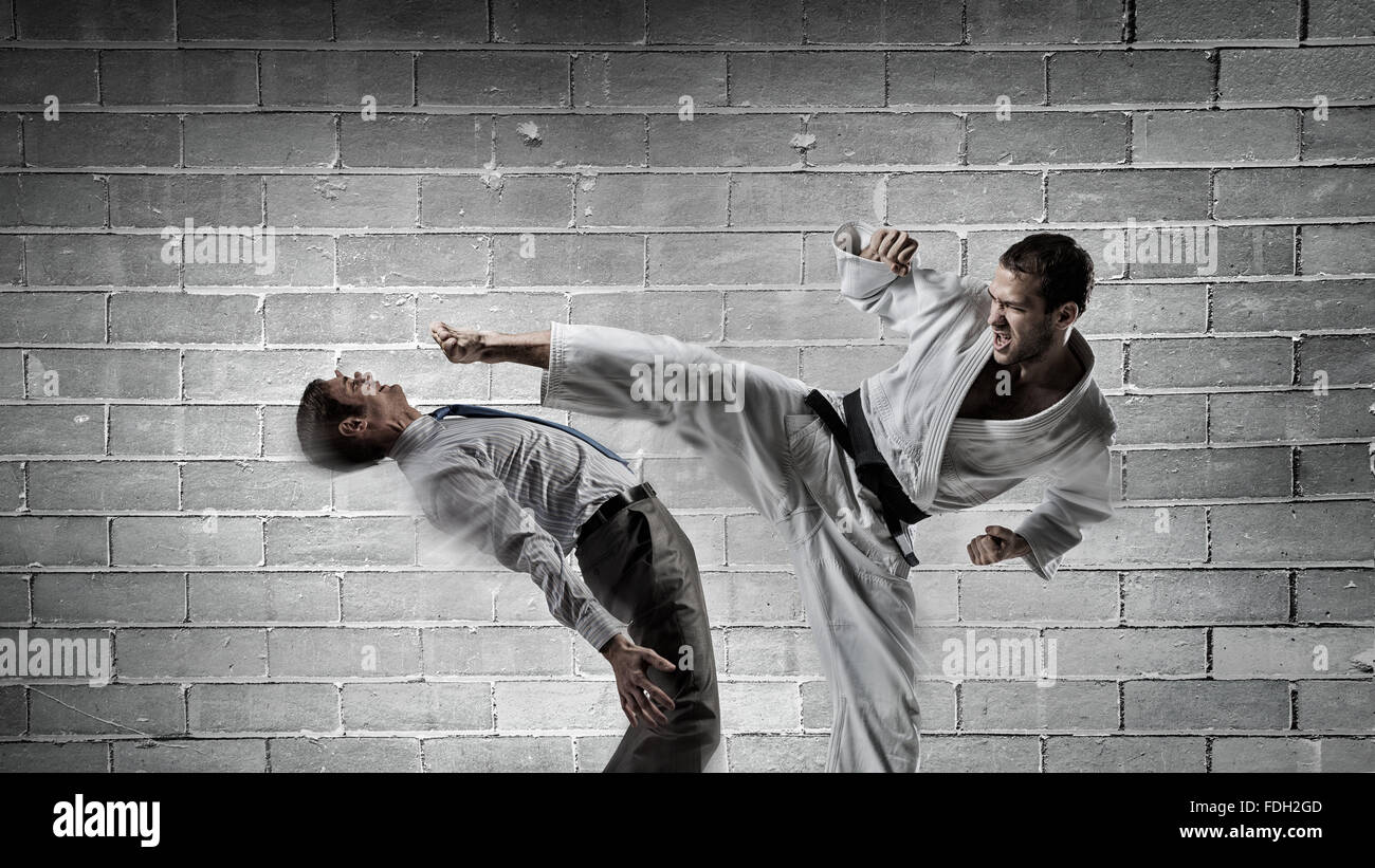 Businessman in martial arts fighting hi-res stock photography and ...