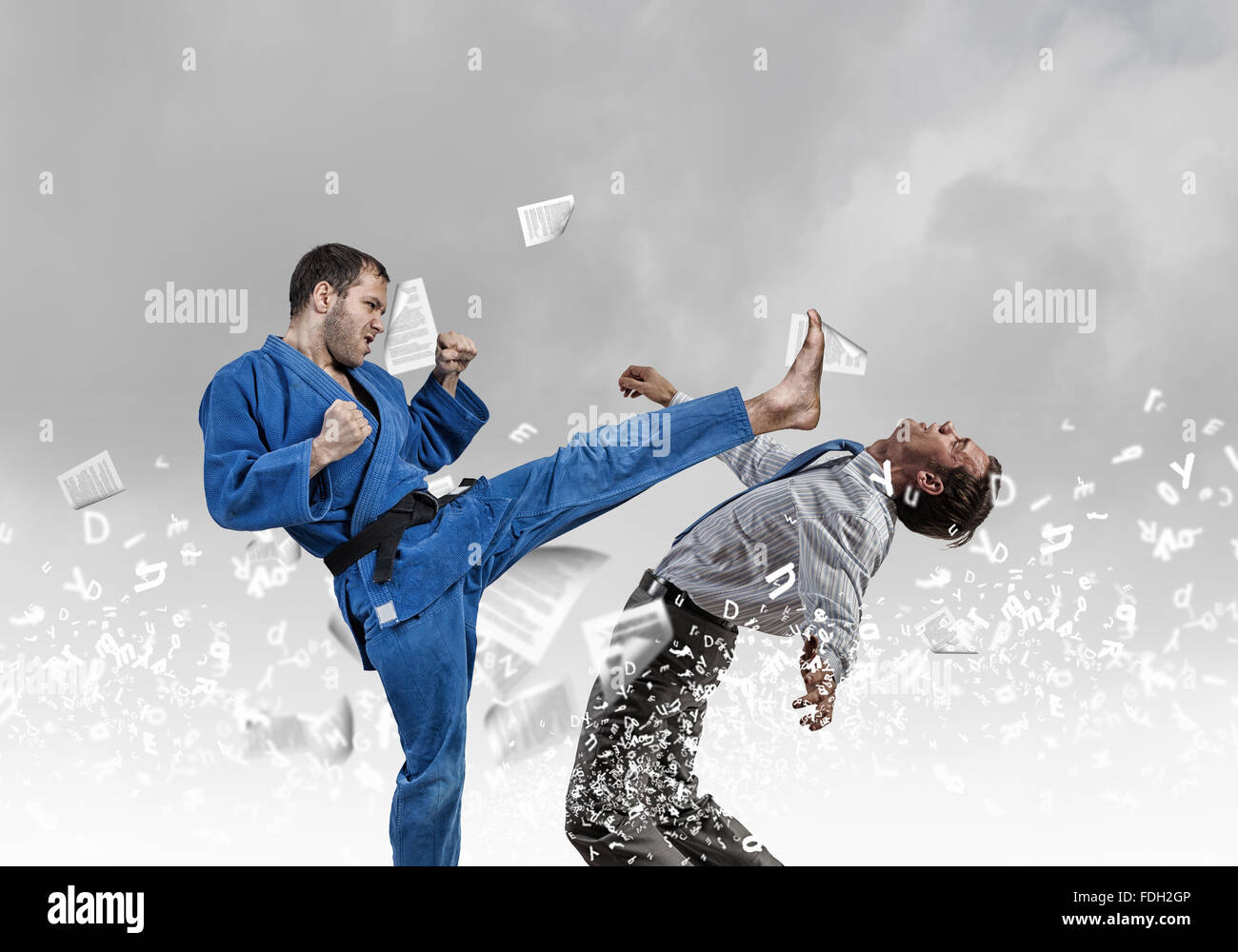 Young determined karate man fighting with businessman in suit Stock ...