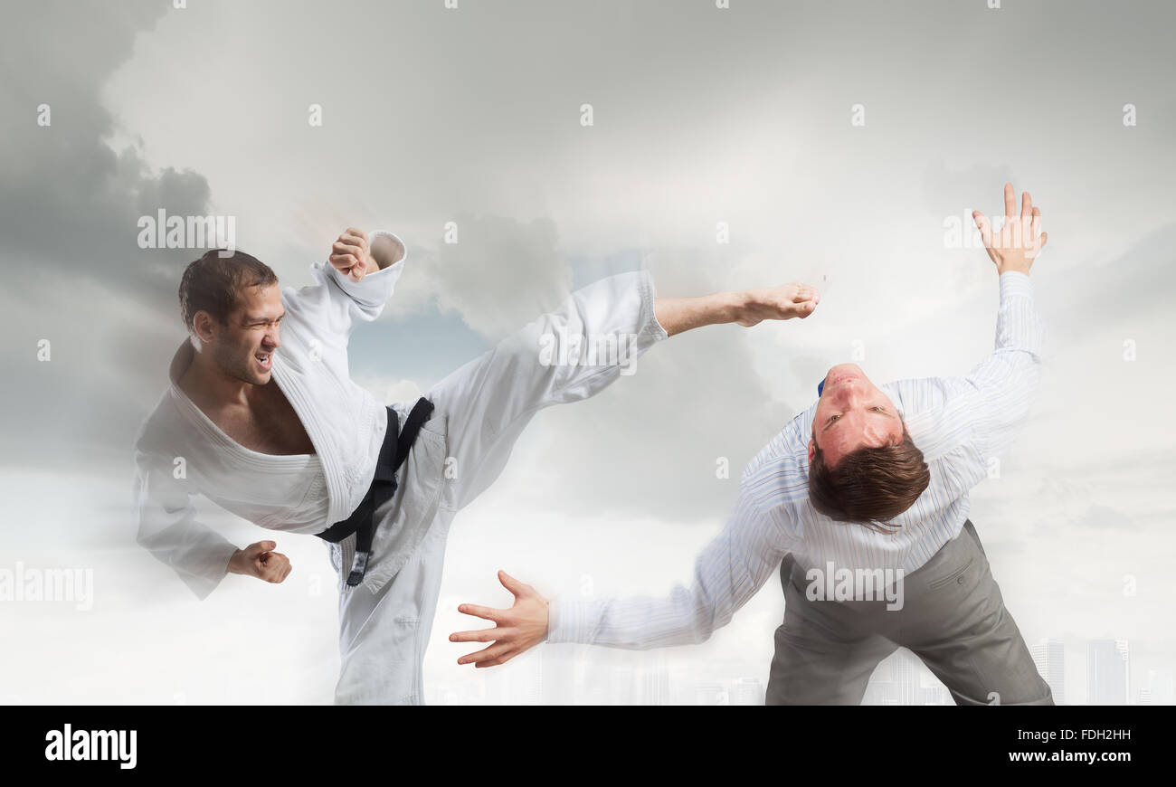 Businessman in martial arts fighting hi-res stock photography and ...