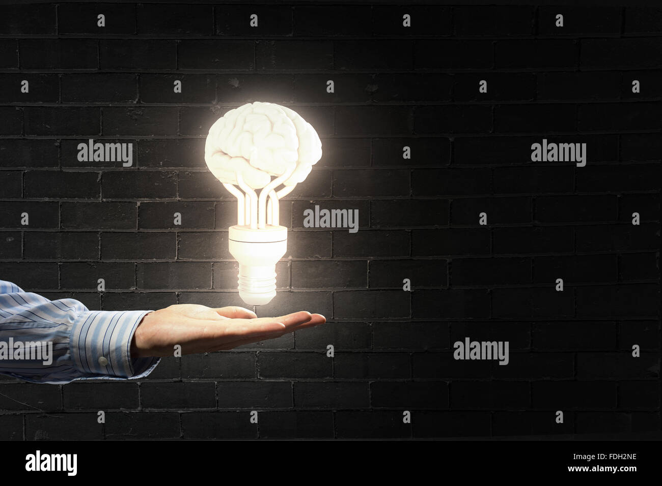 Businessman holding image of human brain in palm Stock Photo - Alamy