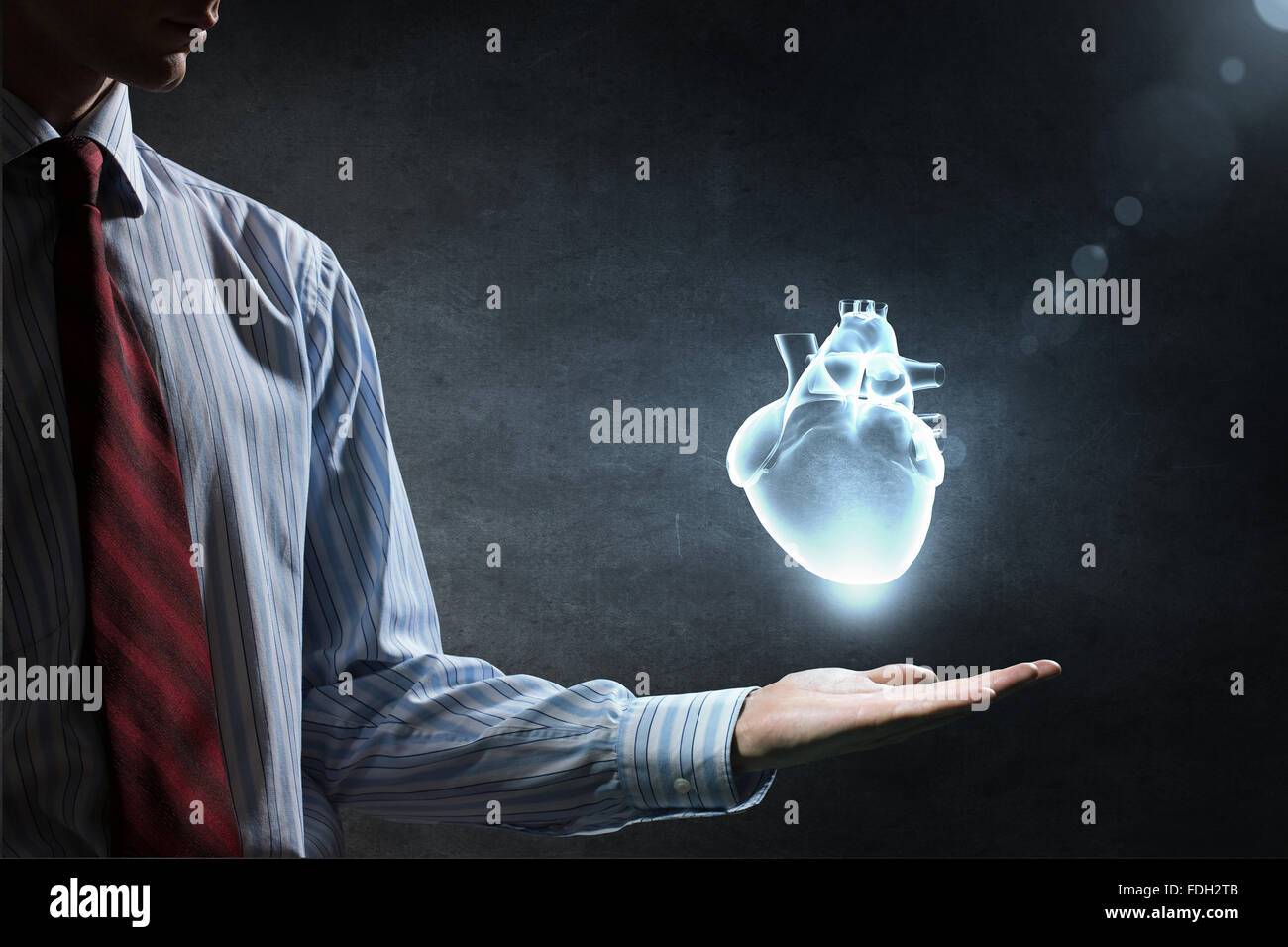 Close up of man hand holding human heart Stock Photo - Alamy