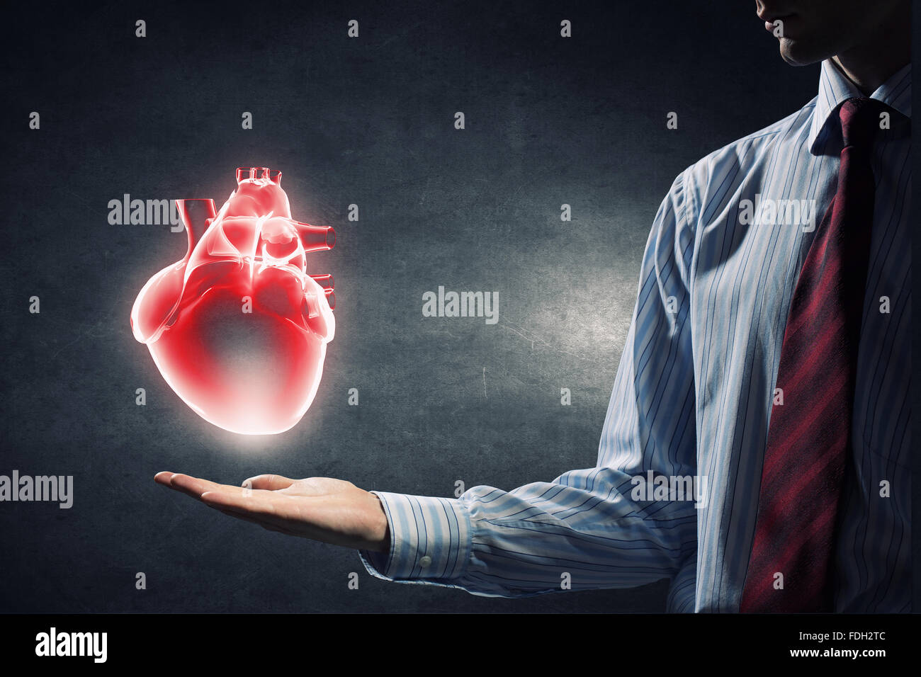 Close up of man hand holding human heart Stock Photo - Alamy