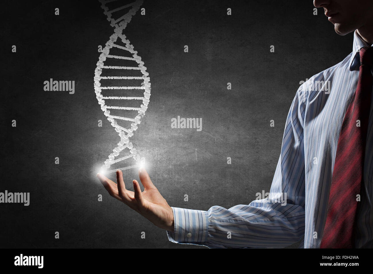 Hand of businessman holding dna molecule concept Stock Photo - Alamy