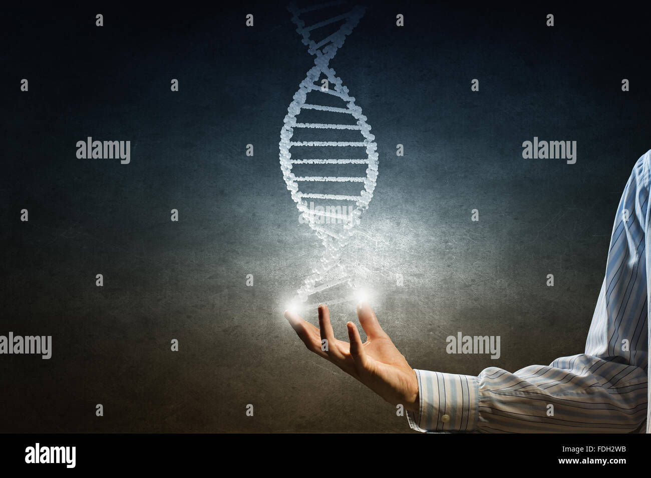 Hand of businessman holding dna molecule concept Stock Photo - Alamy