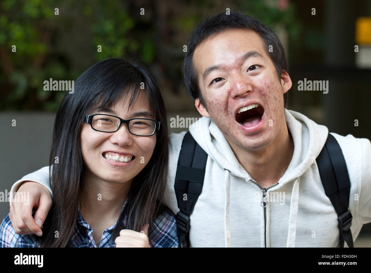 Asian friends with big smile Stock Photo - Alamy
