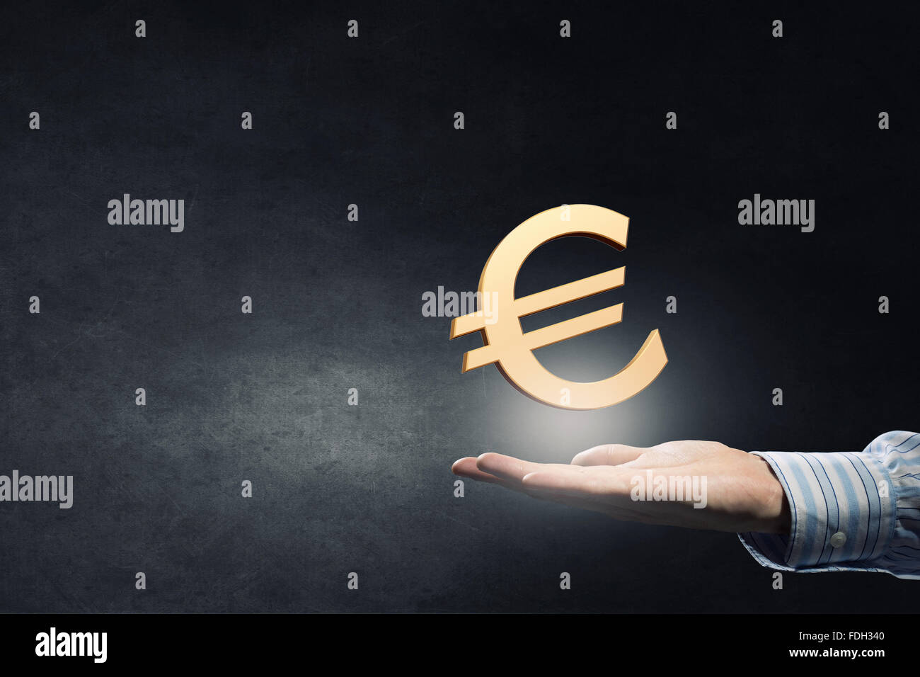 Hand of businessman holding euro sign in palm Stock Photo - Alamy