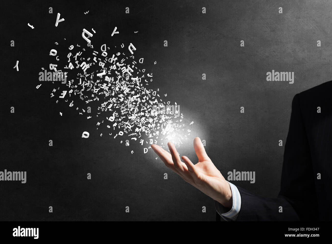 Close up of male hand and characters flying of palm Stock Photo - Alamy