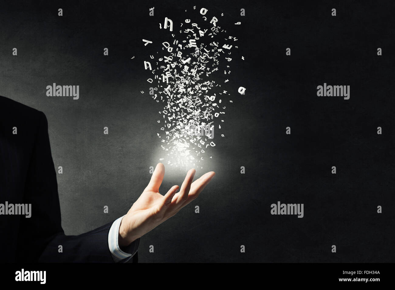 Close up of male hand and characters flying of palm Stock Photo - Alamy