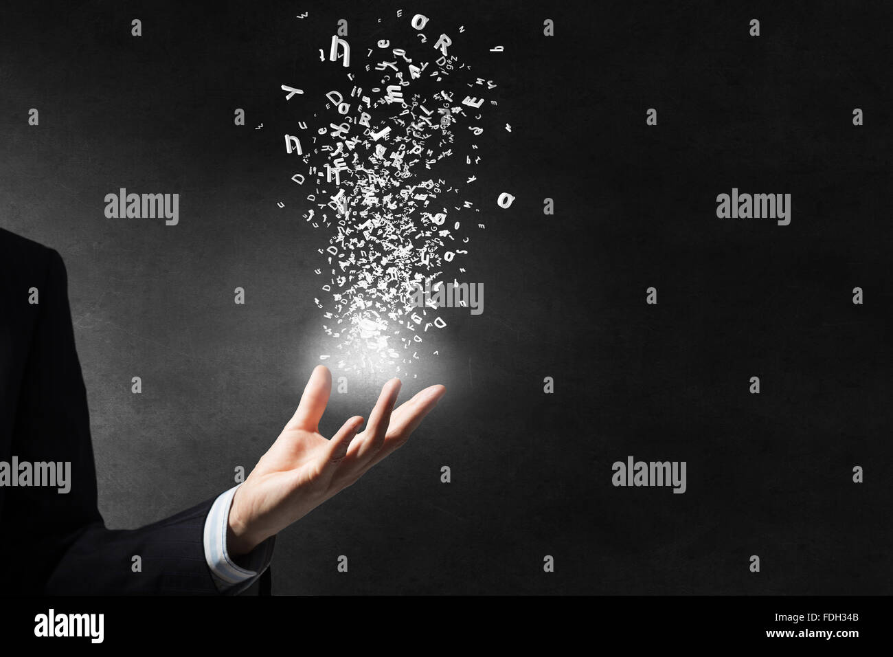 Close up of male hand and characters flying of palm Stock Photo - Alamy