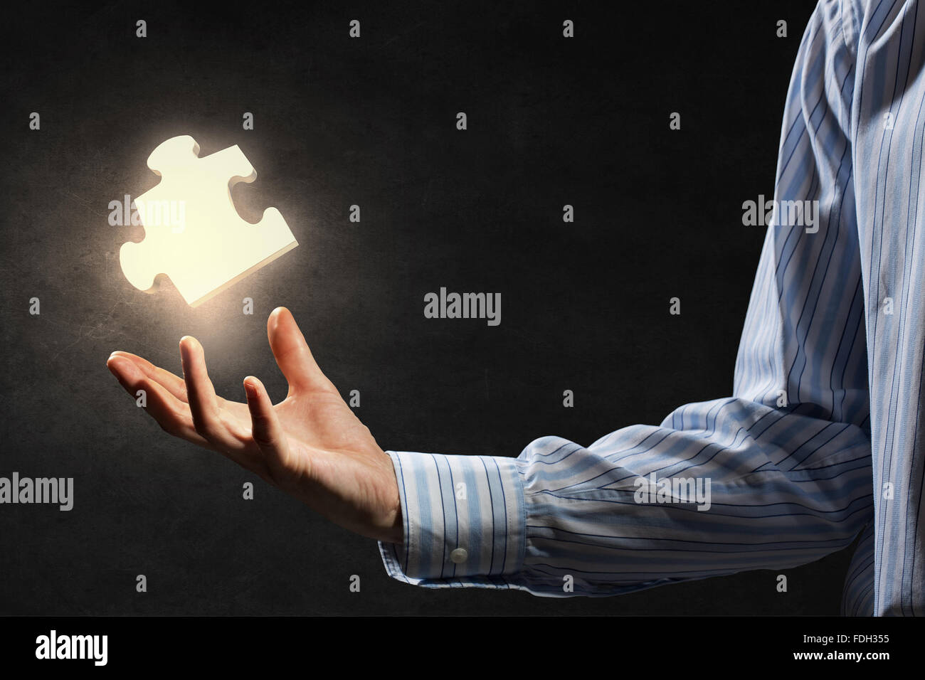 Human hand holding in palm puzzle glowing element Stock Photo - Alamy Human hand holding in palm puzzle glowing element Stock Photo - Alamy
