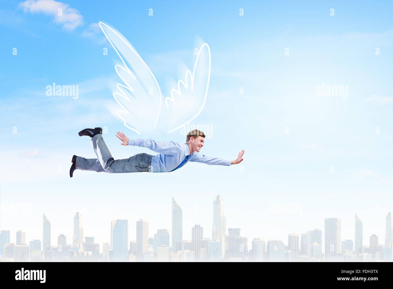 Young businessman with drawn wings flying in sky Stock Photo - Alamy